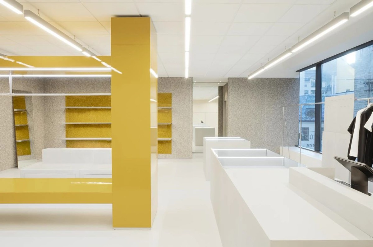 Collage, a luxury fashion retail store for men and women, bright yellow ...