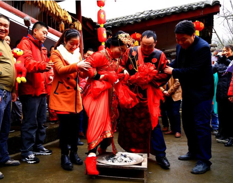 Why does the bride cross the brazier when going to the door?Why use a ...