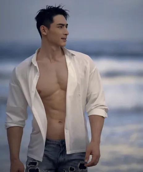 Male model photo (1): A muscular male model walking on the top of ...
