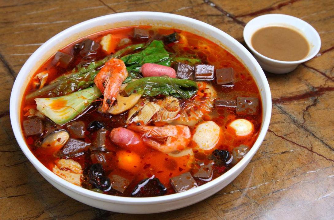 The few "essential dishes" of Mala Tang were placed "on the side" by ...