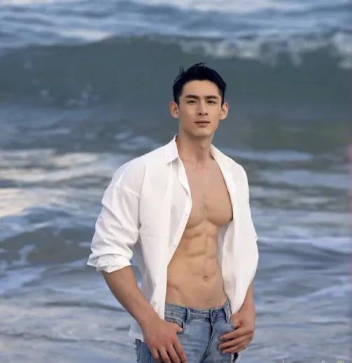 Male model photo (1): A muscular male model walking on the top of ...